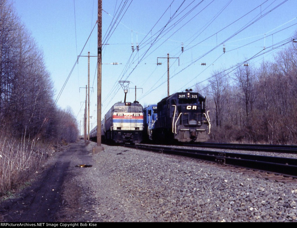 Amtrak 959 South, passing a stopped Conrail freight